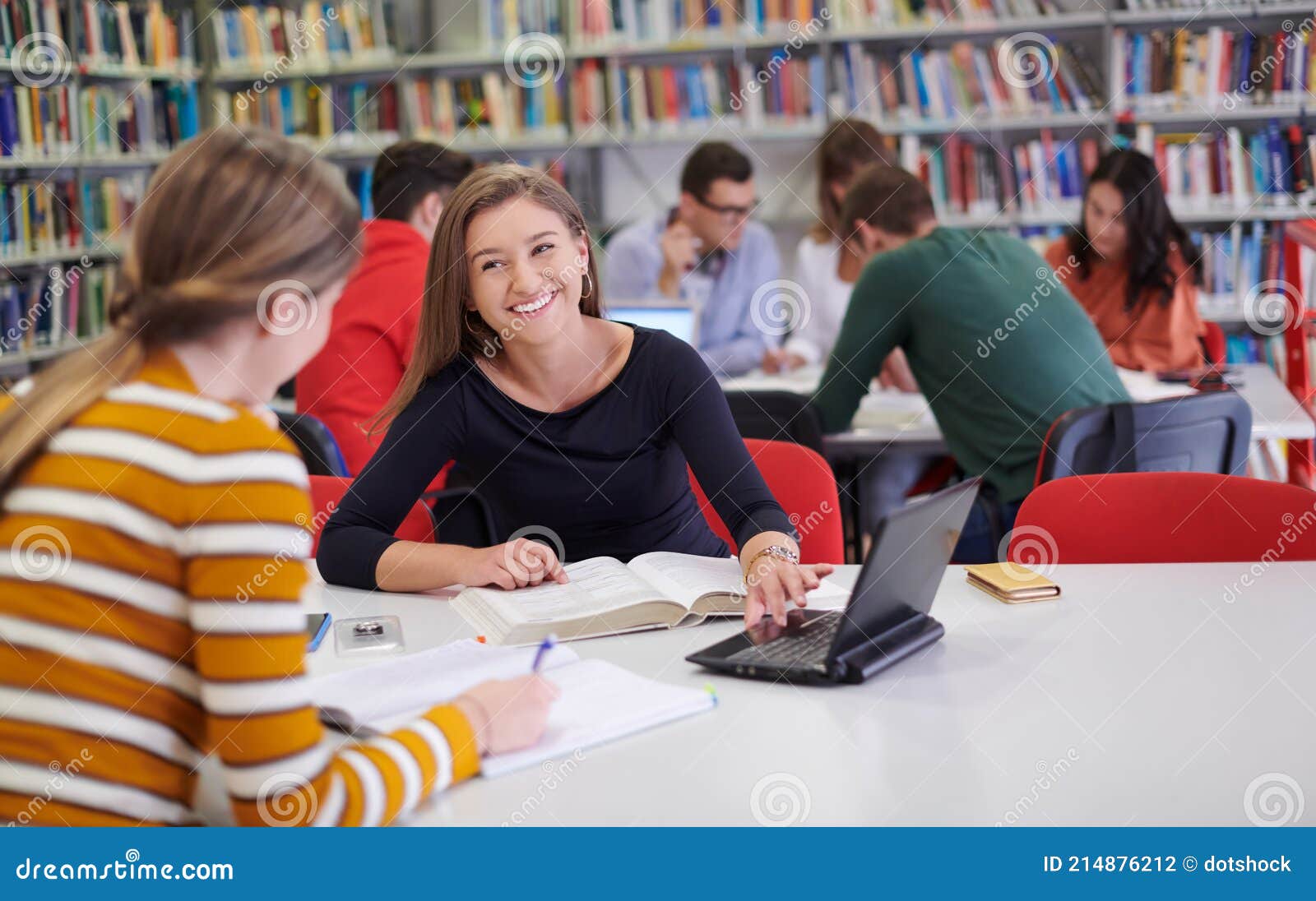 The Student Uses a Notebook and a School Library Stock Photo - Image of ...