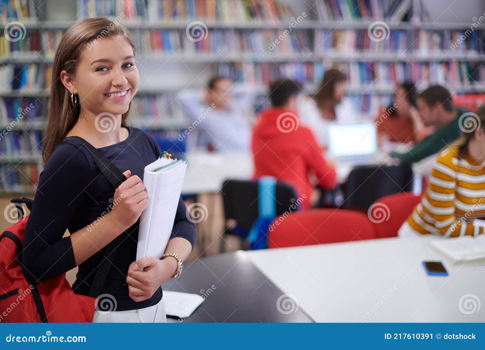 The Student Uses a Notebook and a School Library Stock Image - Image of ...
