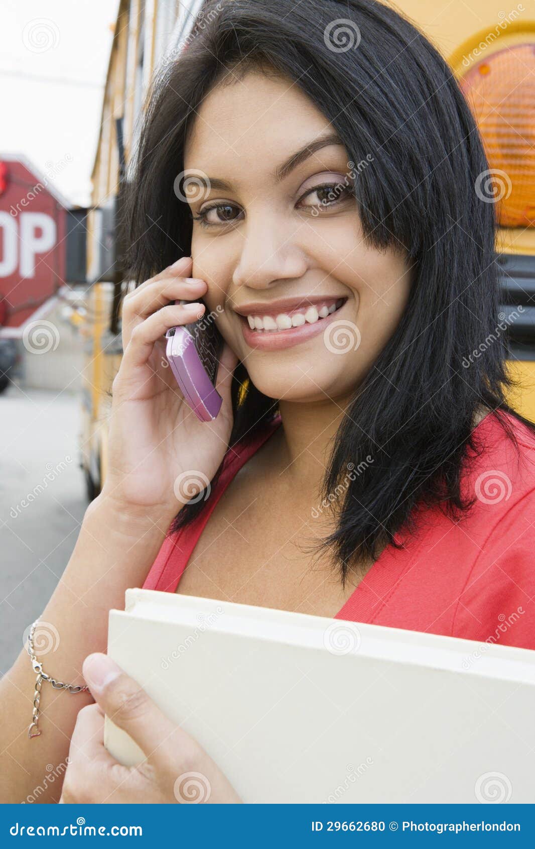 Student Using Cell Phone by School Bus Stock Photo - Image of ...