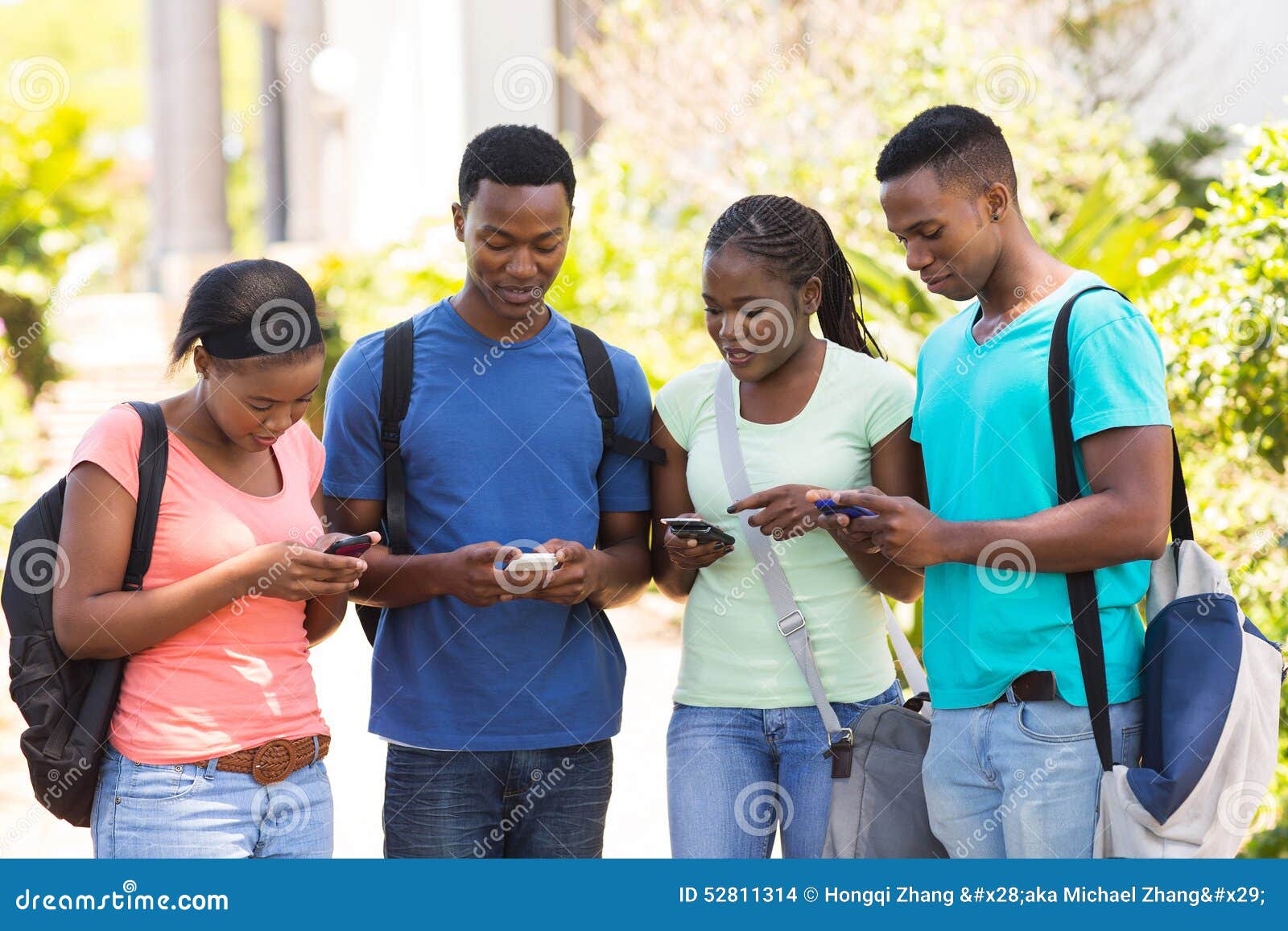 Student using cell phones stock photo. Image of friends - 52811314