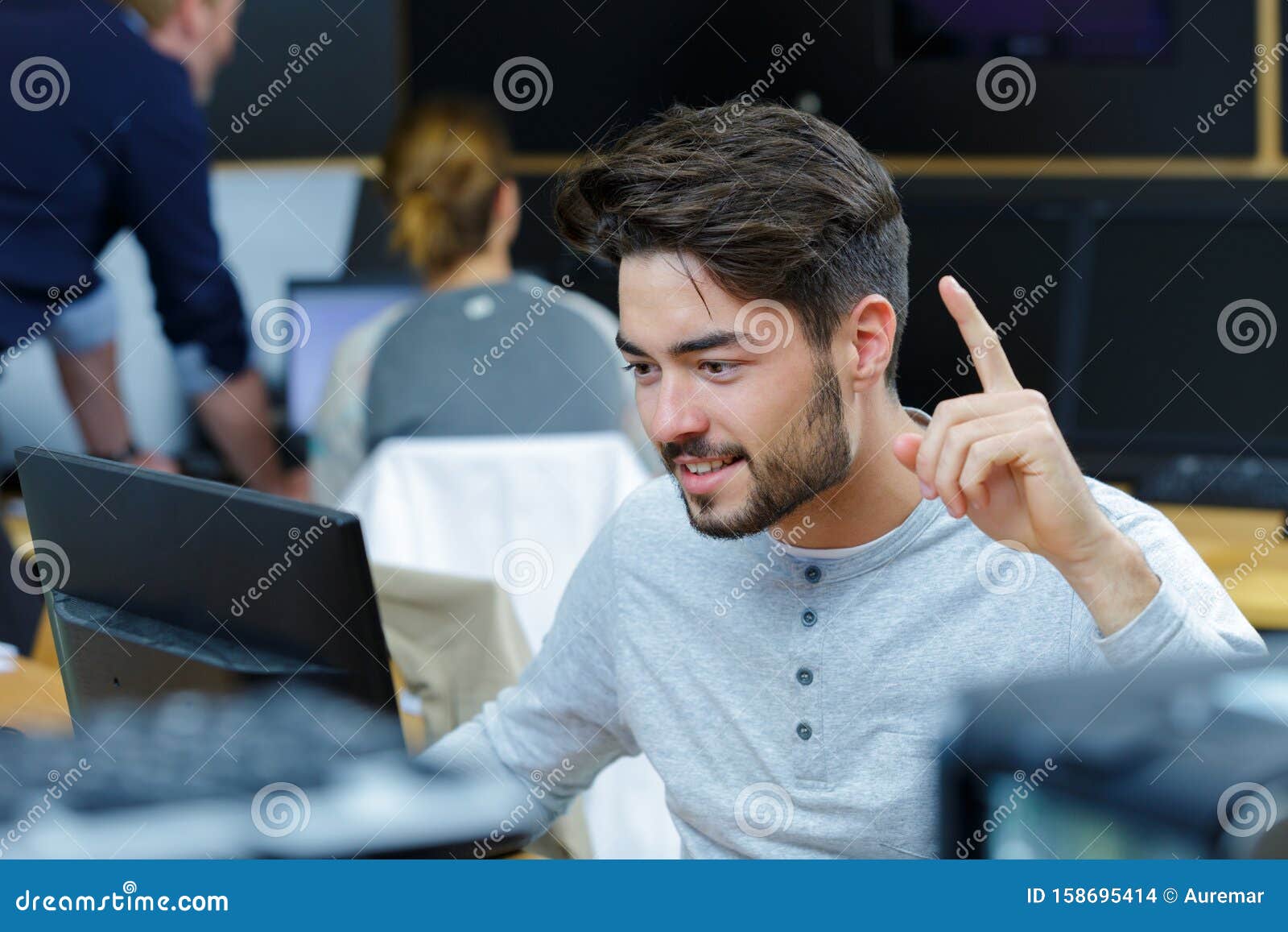 Student Using Computer with Finger Raised Stock Photo - Image of ...