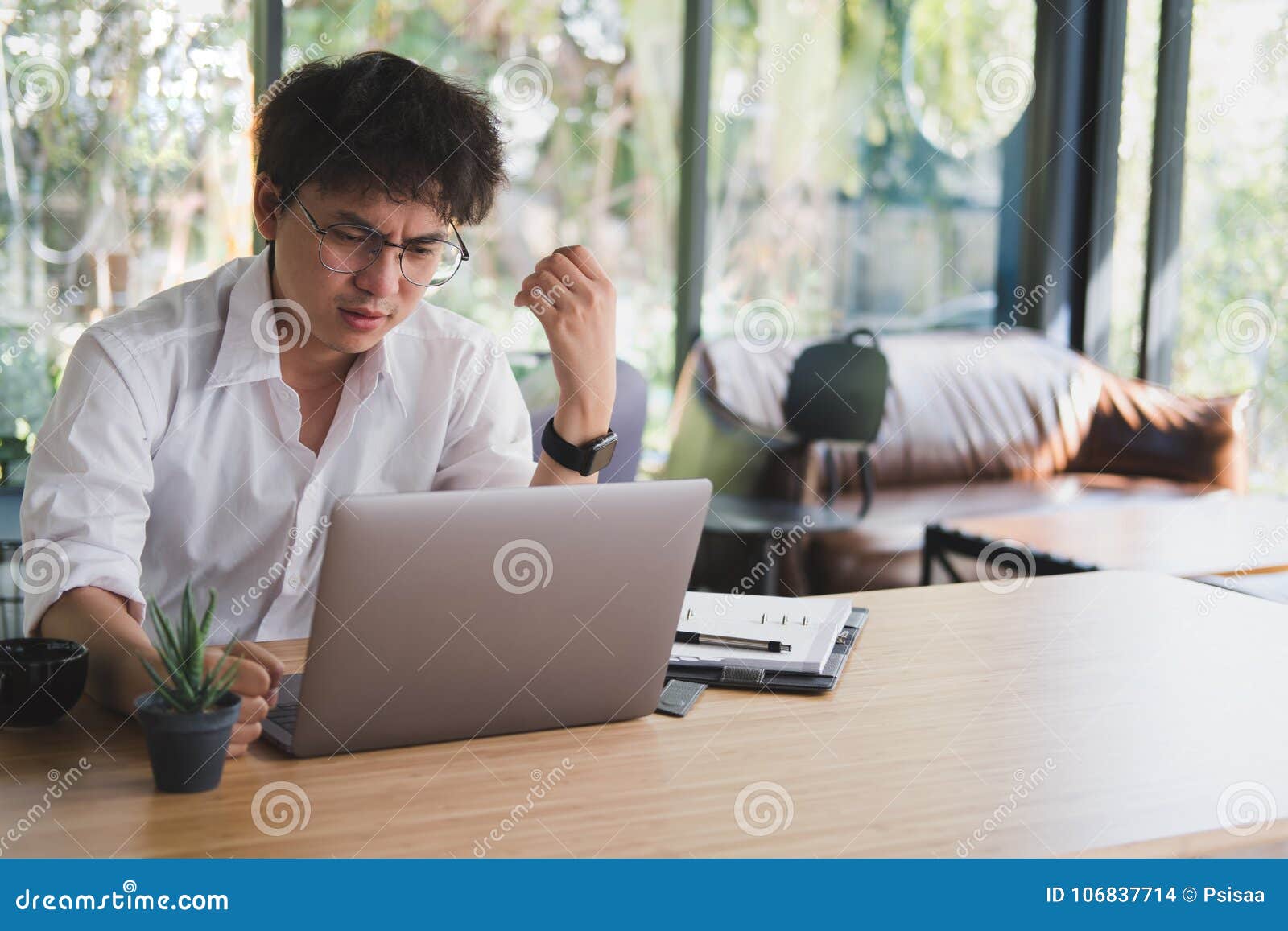 Student Using Computer for Learning Leasson Online at Cafe. Angry ...
