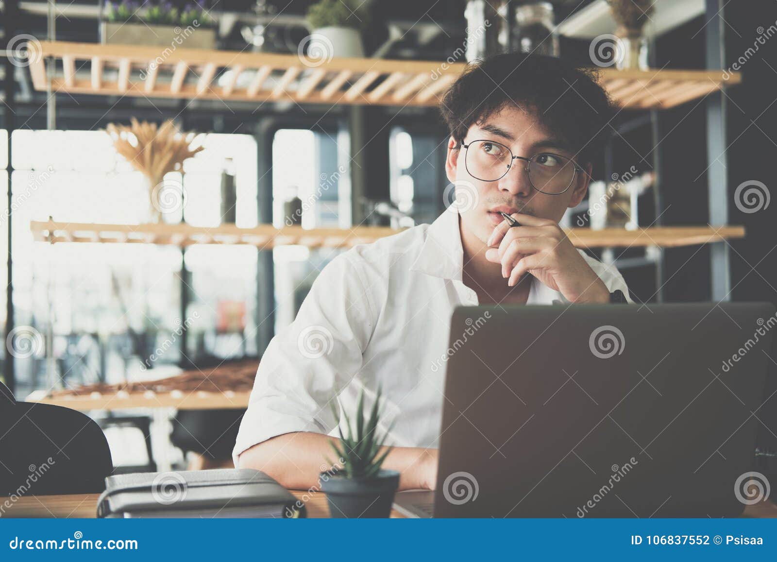 Student Using Computer for Learning Leasson Online at Cafe. Star Stock ...