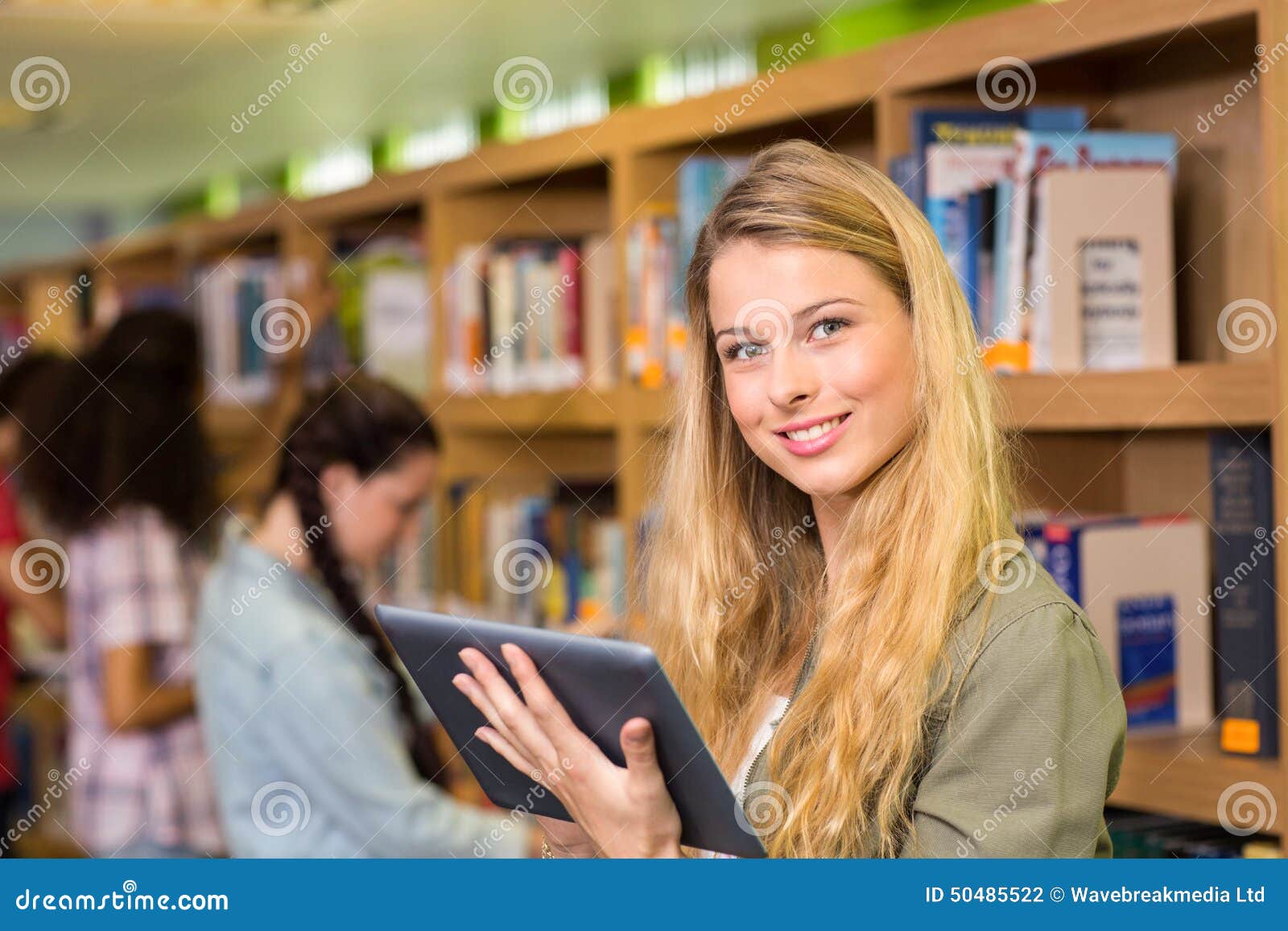 Student Using Digital Tablet in Library Stock Photo - Image of internet ...