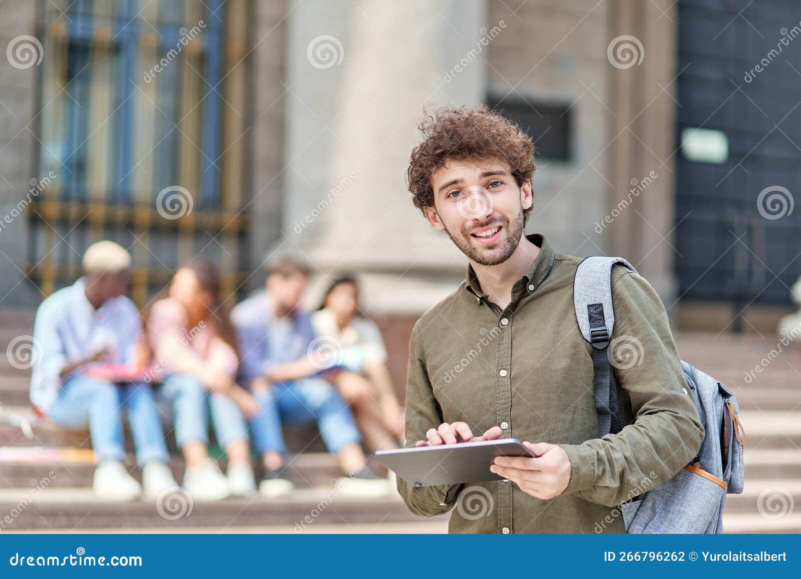 Student Using a Digital Tablet while Standing in Front of the ...