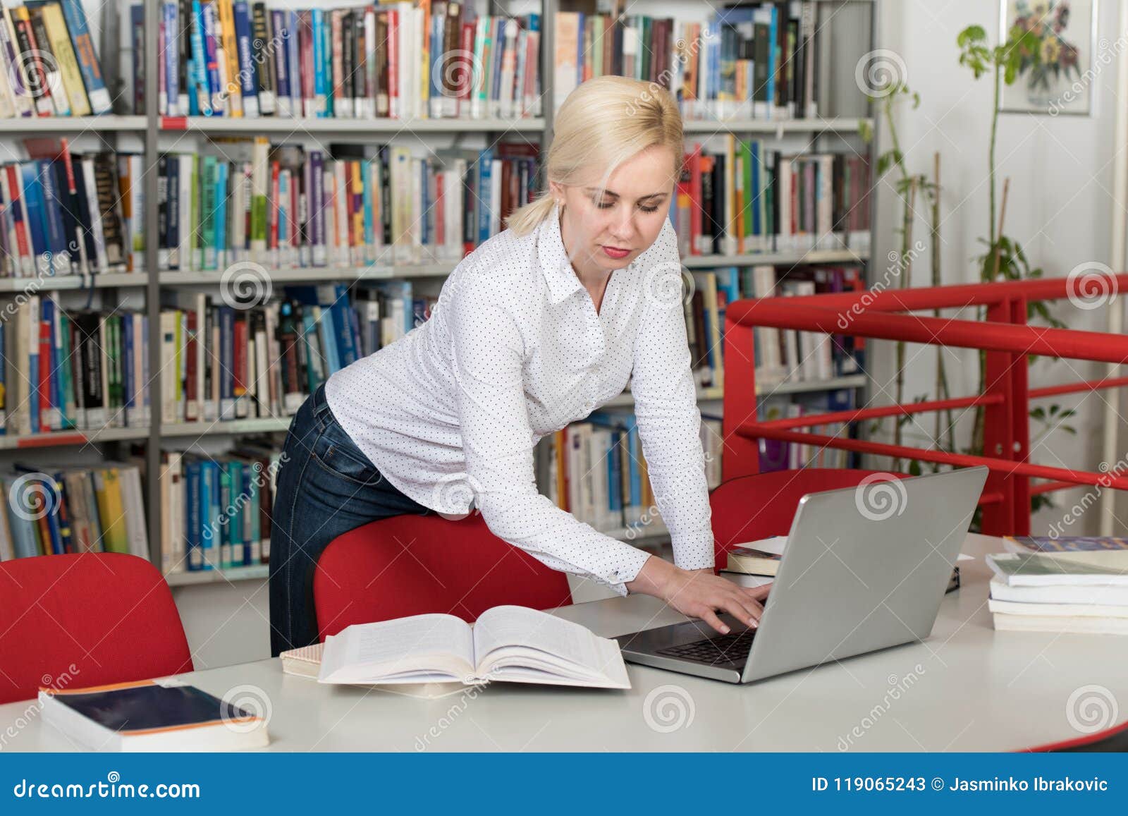 Student Using Her Laptop in a Library Stock Image - Image of people ...