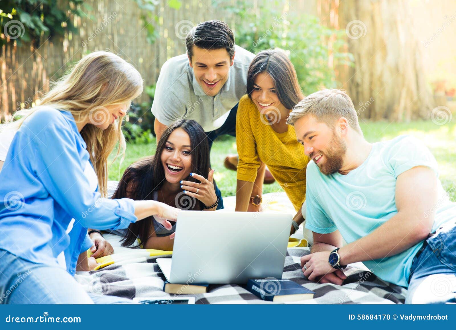Student Using Laptop in Campus Stock Photo - Image of freedom, grass ...
