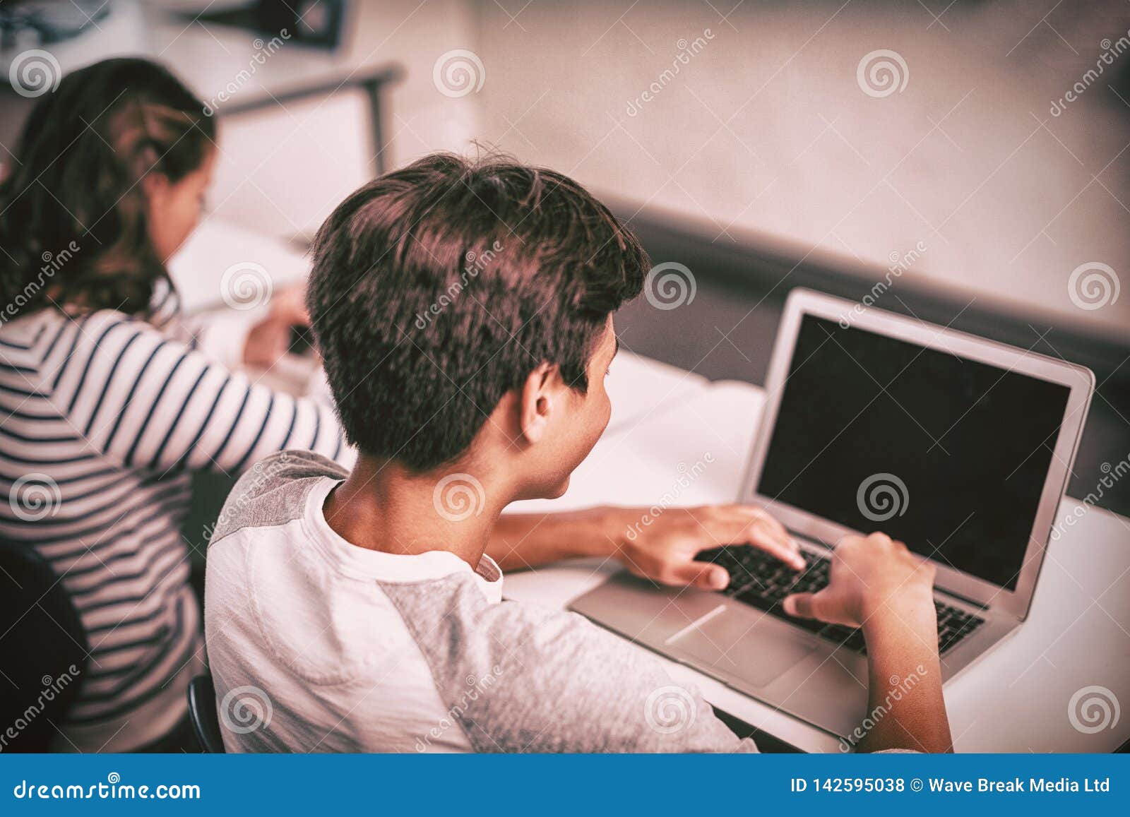 Student Using Laptop in Classroom Stock Photo - Image of laptop ...