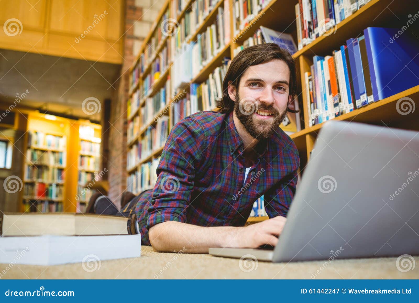 Student Using Laptop on Floor in the Library Stock Image - Image of ...
