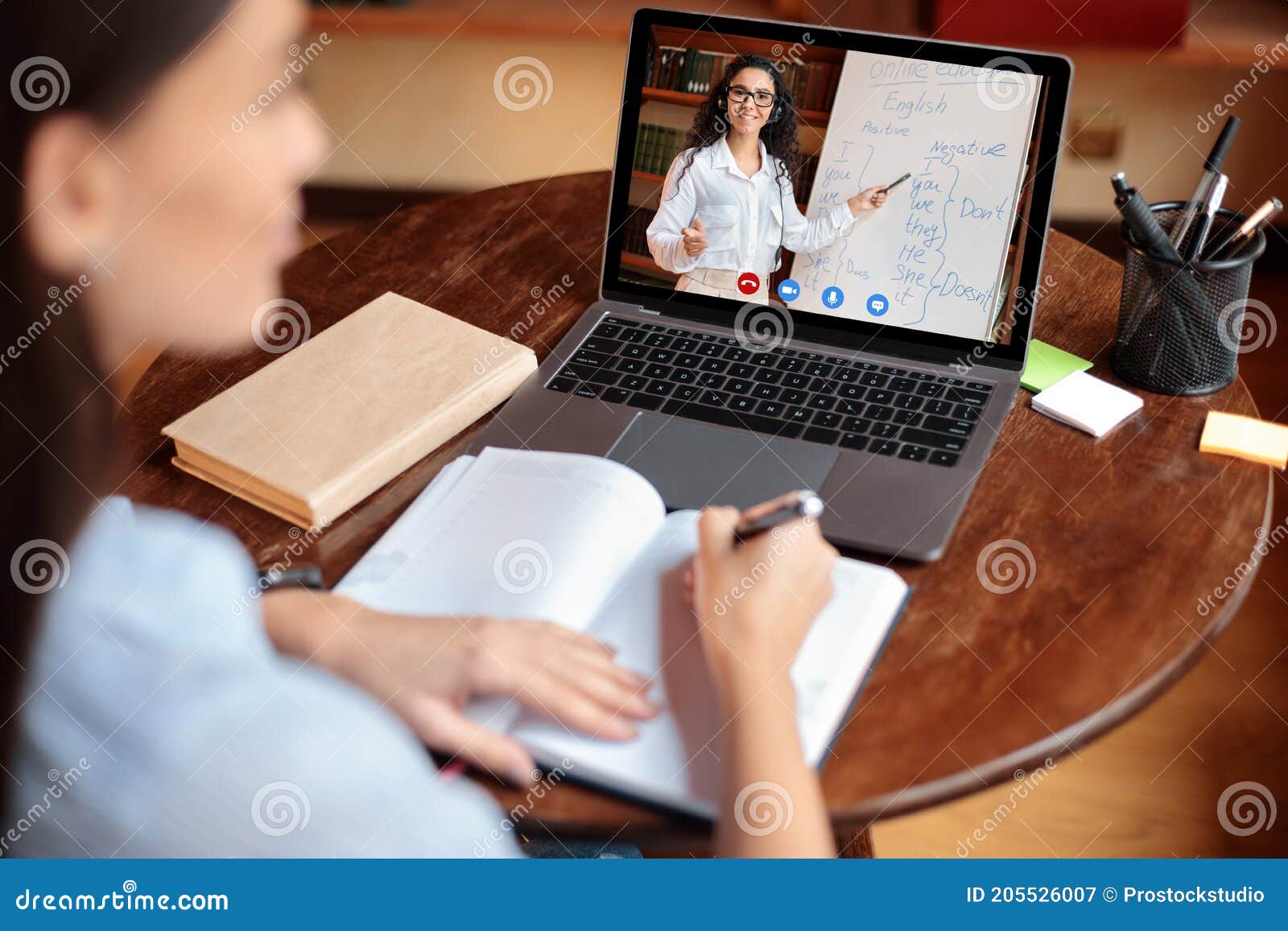 Student Using Laptop Having Online Class with Teacher, Over Shoulder ...
