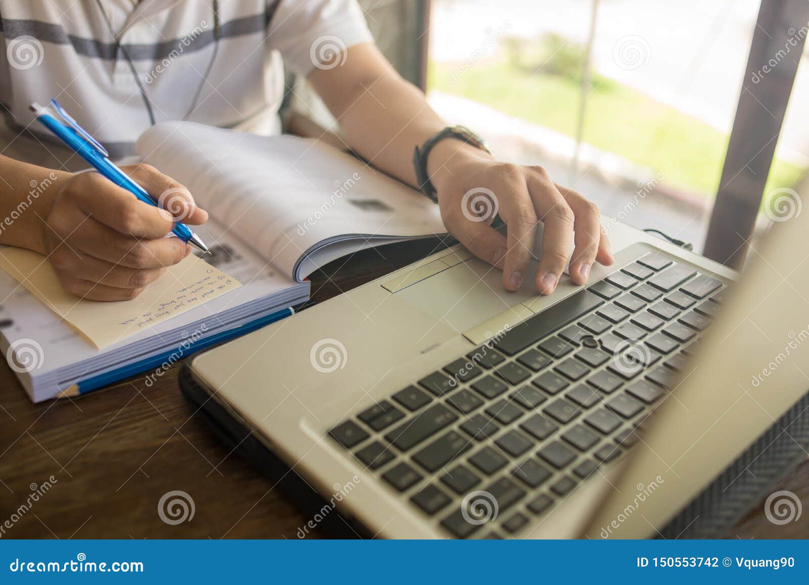 Human Hand Using Laptop and Writing Note on Wooden Table Stock Photo ...