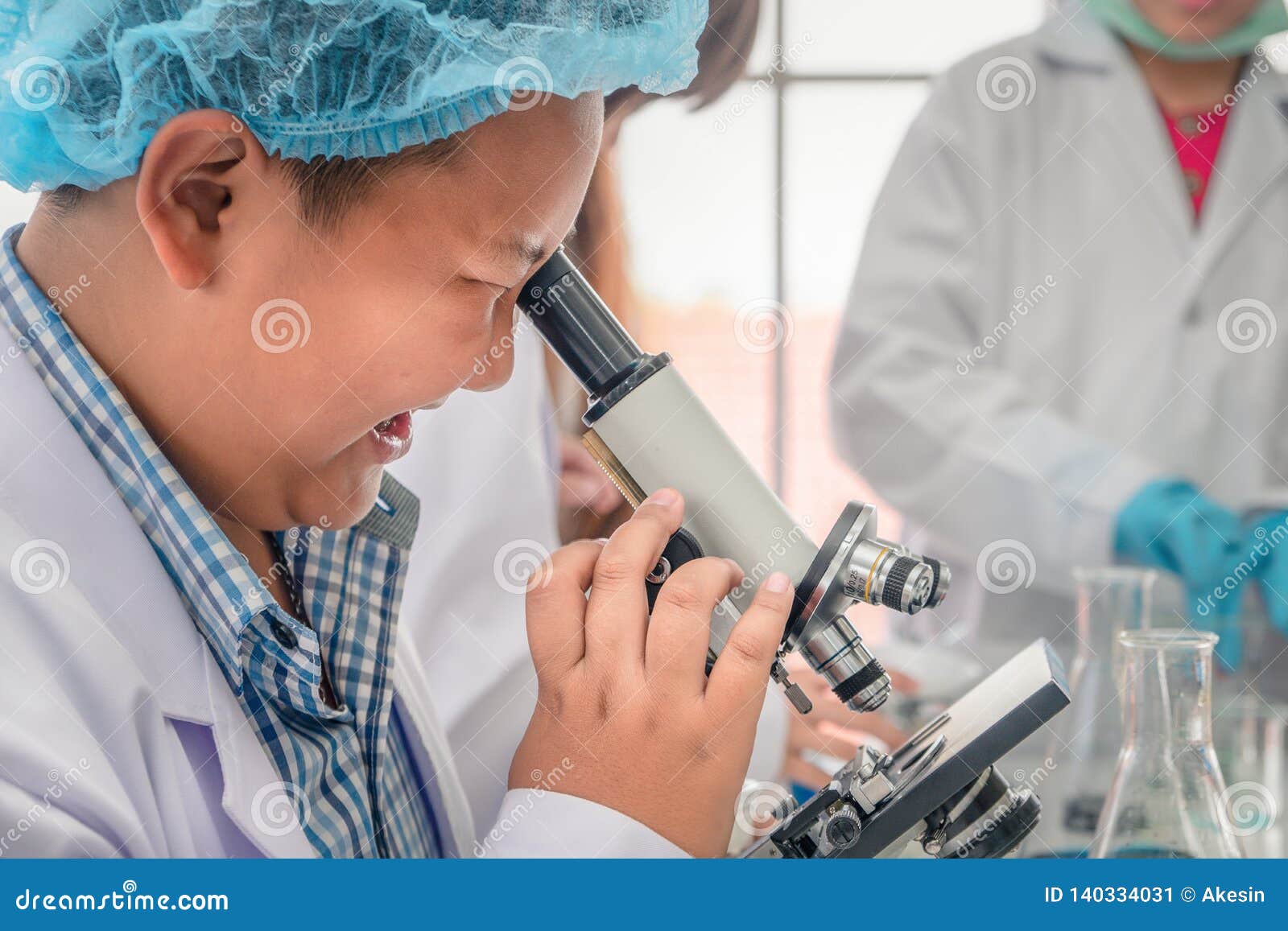 Student Using Microscope in Biology Laboratory Stock Image - Image of ...