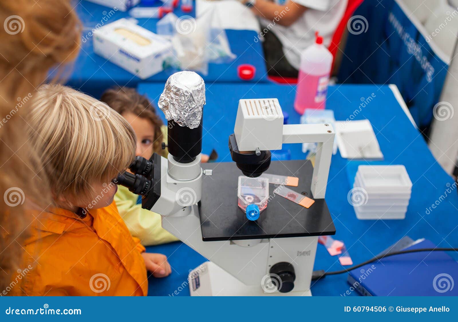 Student using a microscope editorial photo. Image of microscope - 60794506