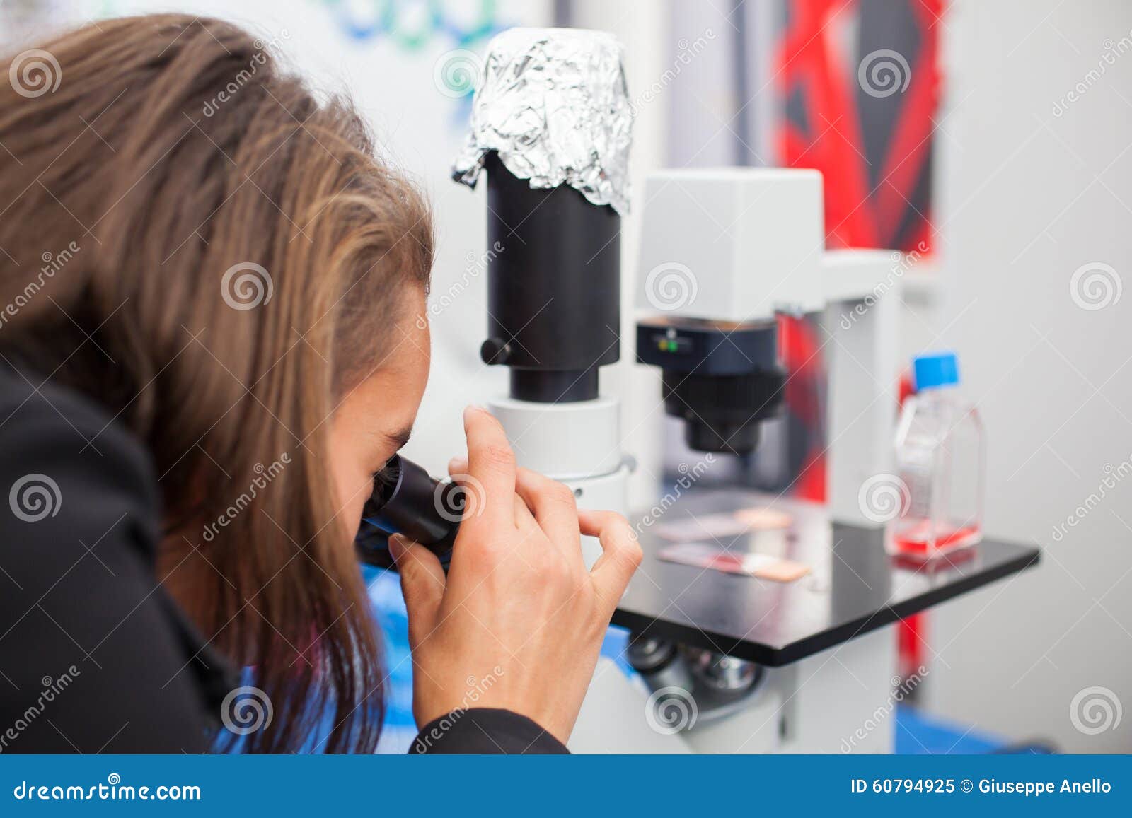 Student using a microscope editorial image. Image of analyzing - 60794925