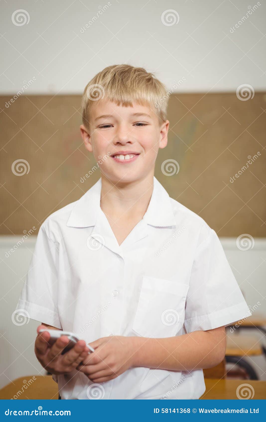 Student Using a Mobile Phone in Class Stock Photo - Image of desk ...