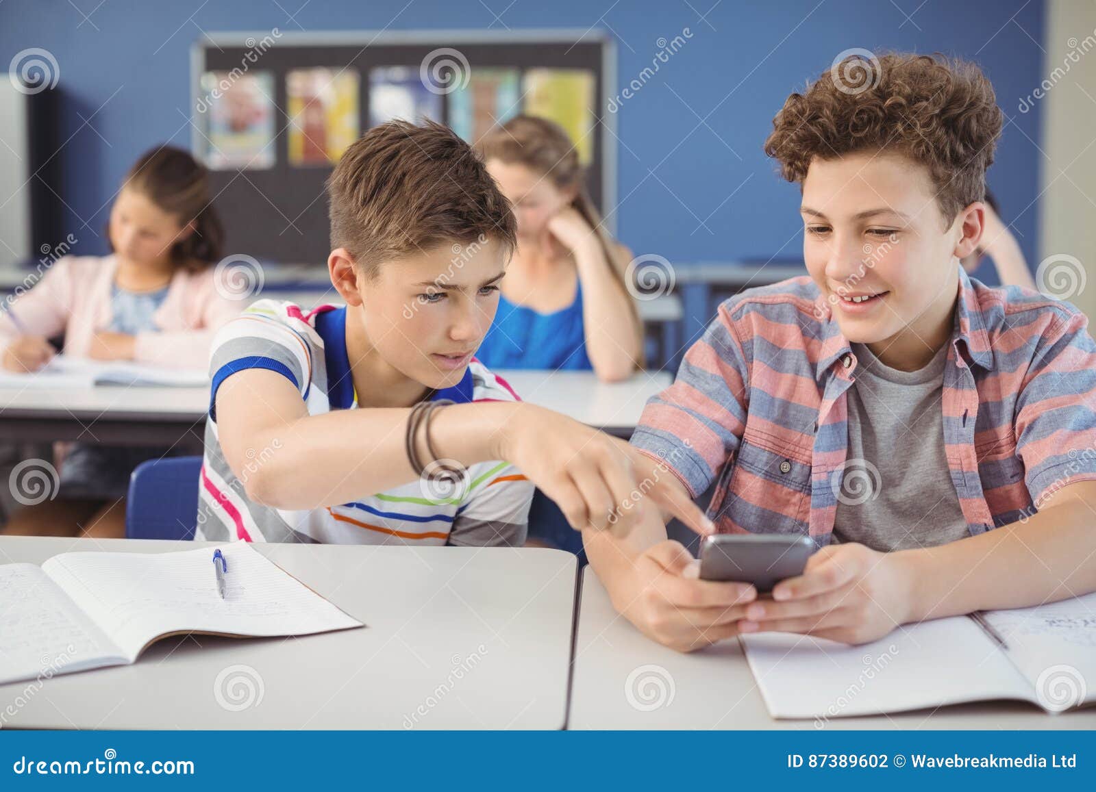 Student Using Mobile Phone in Classroom Stock Photo - Image of girl ...
