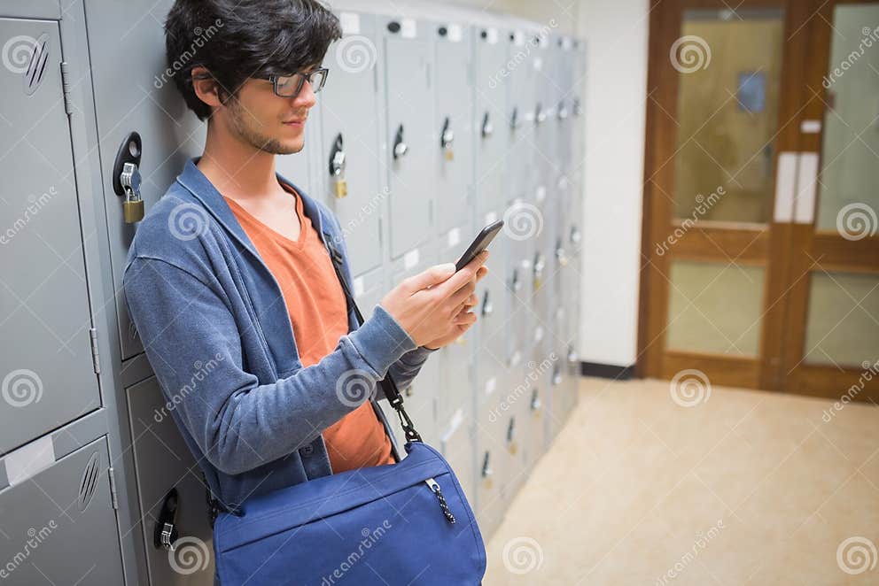 Student Using Mobile Phone in Locker Room Stock Photo - Image of ...