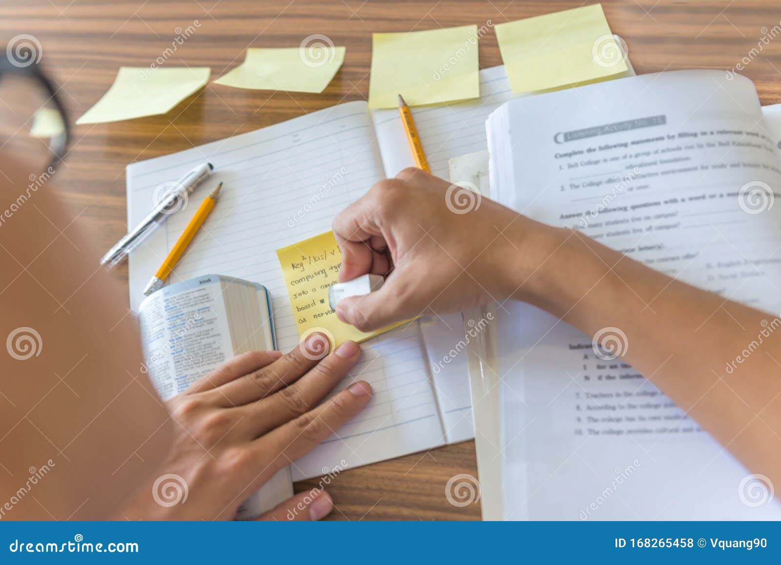 Student Using Pencil, Eraser Information Sticky Note Stock Photo ...