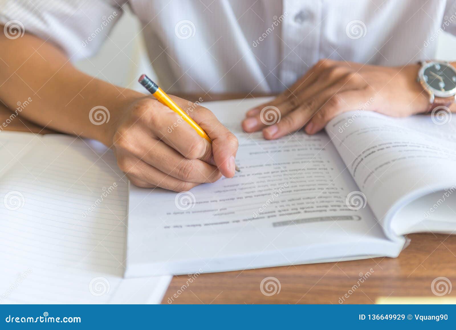 Student Using Pencil To Take Note and Highlight Main Ideas Stock Image ...