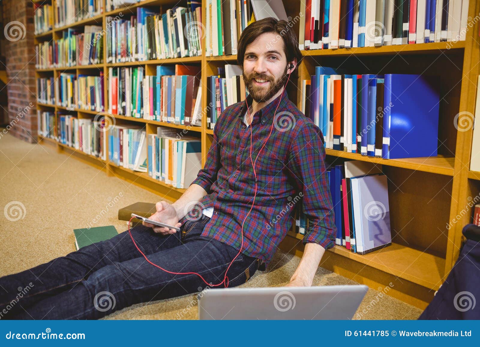 Student Using Phone in Library on Floor Stock Image - Image of music ...