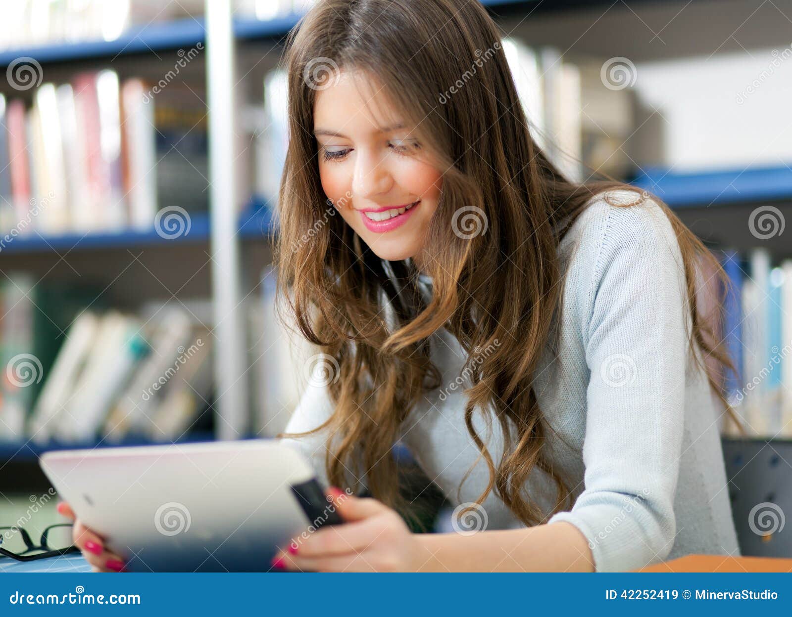 Student Using a Tablet in a Library Stock Image - Image of person ...
