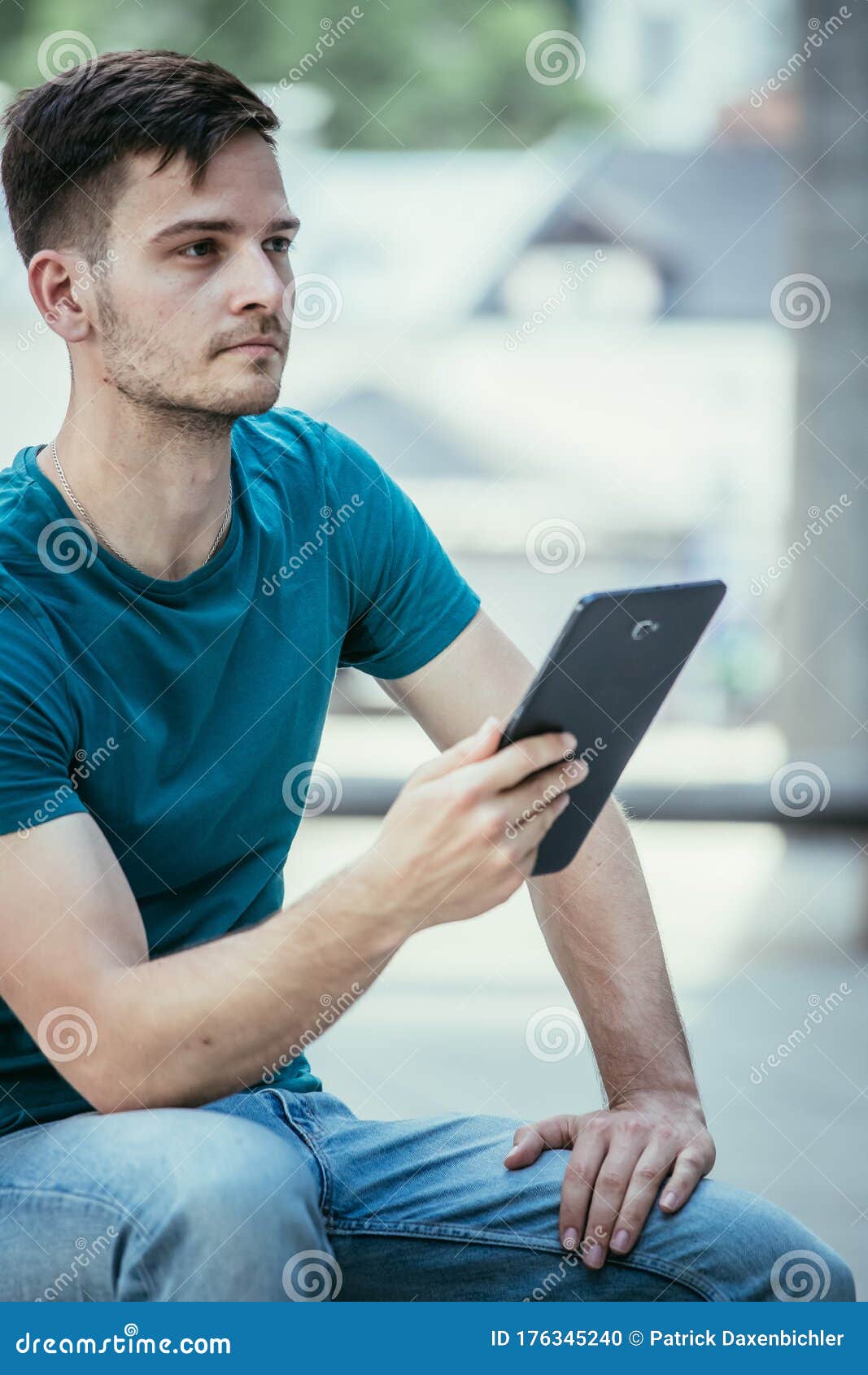 Student Using a Tablet Pc on the Campus. Outdoors, Urban Feeling ...