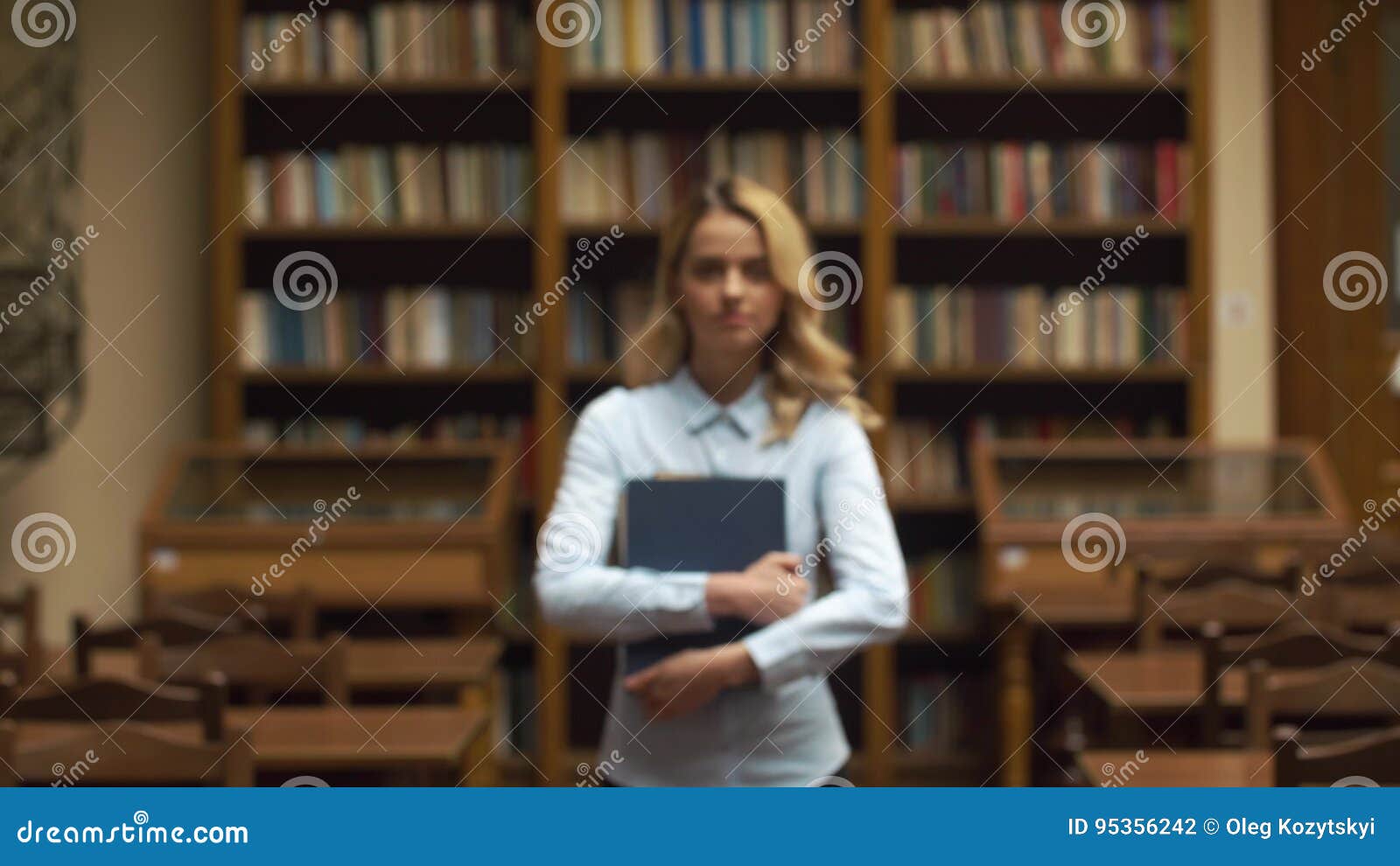 Student Walks with Large Book in the Library Stock Footage - Video of ...