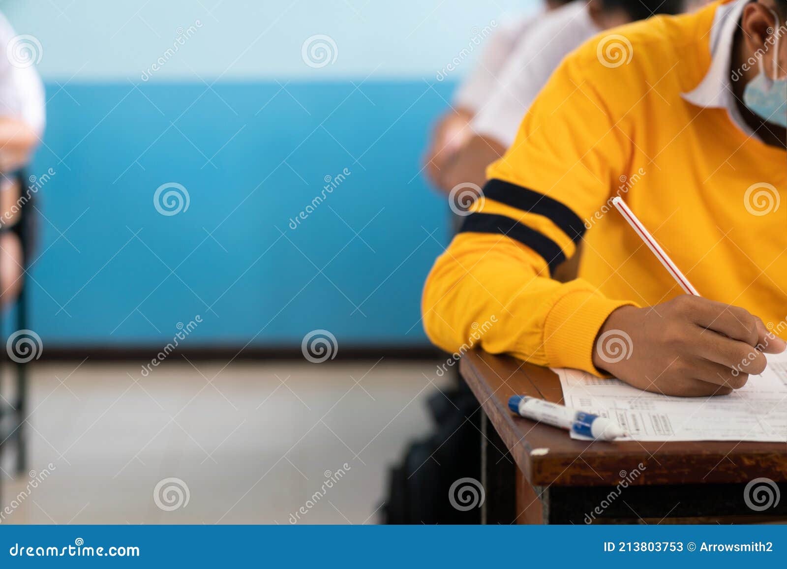Student Wearing Face Mask and Taking Educational Exam Test in Class ...