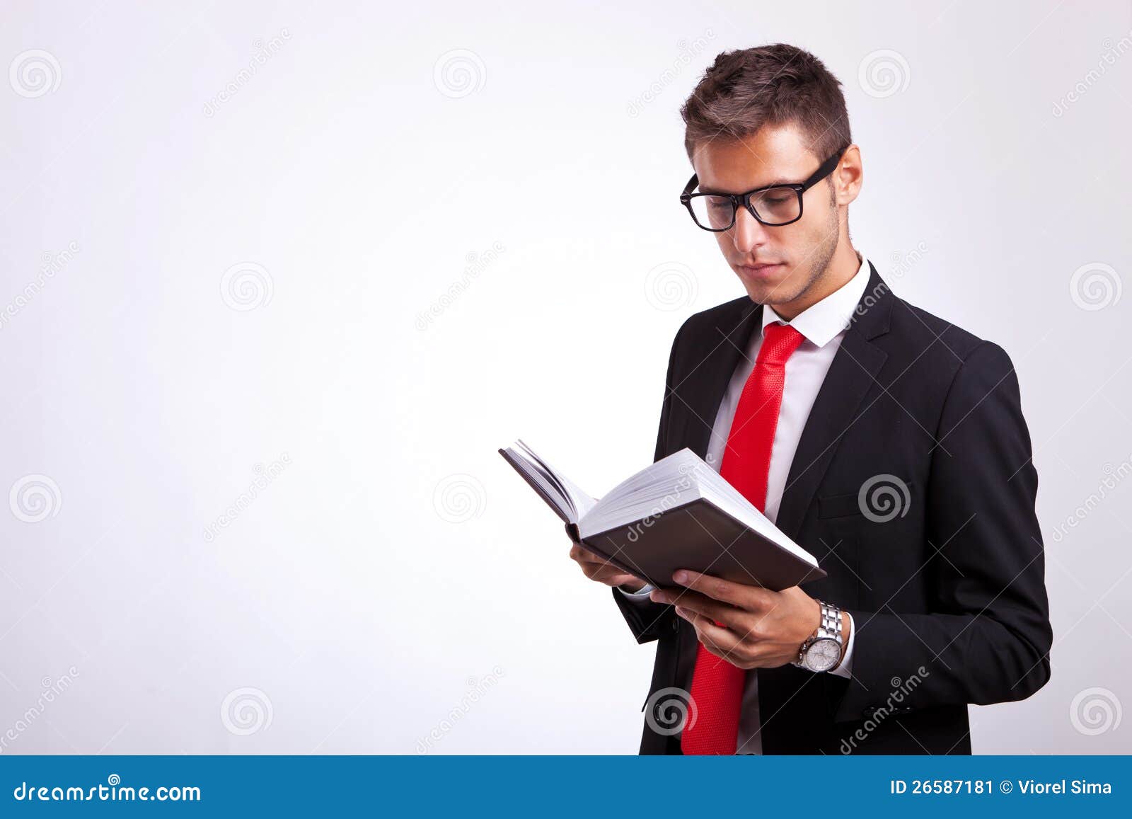 Student Wearing Glasses and Reading a Law Book Stock Image - Image of ...