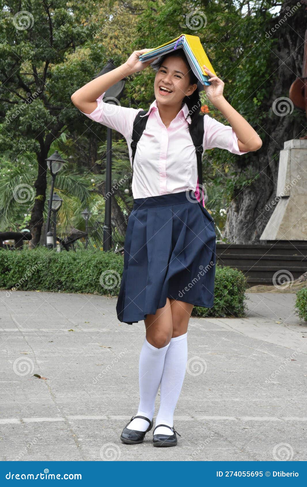 Student Wearing School Uniform with Textbooks Standing Stock Image ...