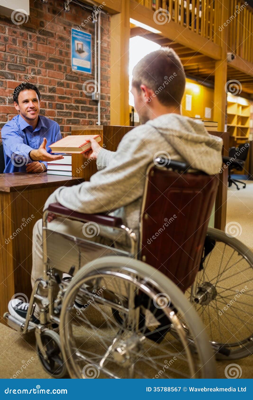 Student in Wheelchair at the Library Counter Stock Image - Image of ...