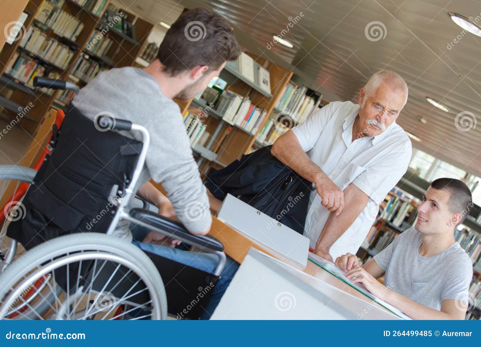Student in Wheelchair in Library with Teacher Stock Image - Image of ...
