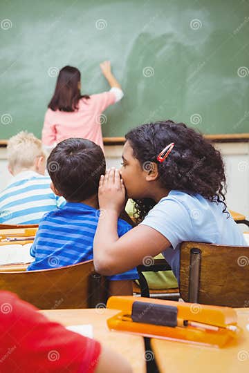 Student Whispering into Another Students Ear Stock Image - Image of ...