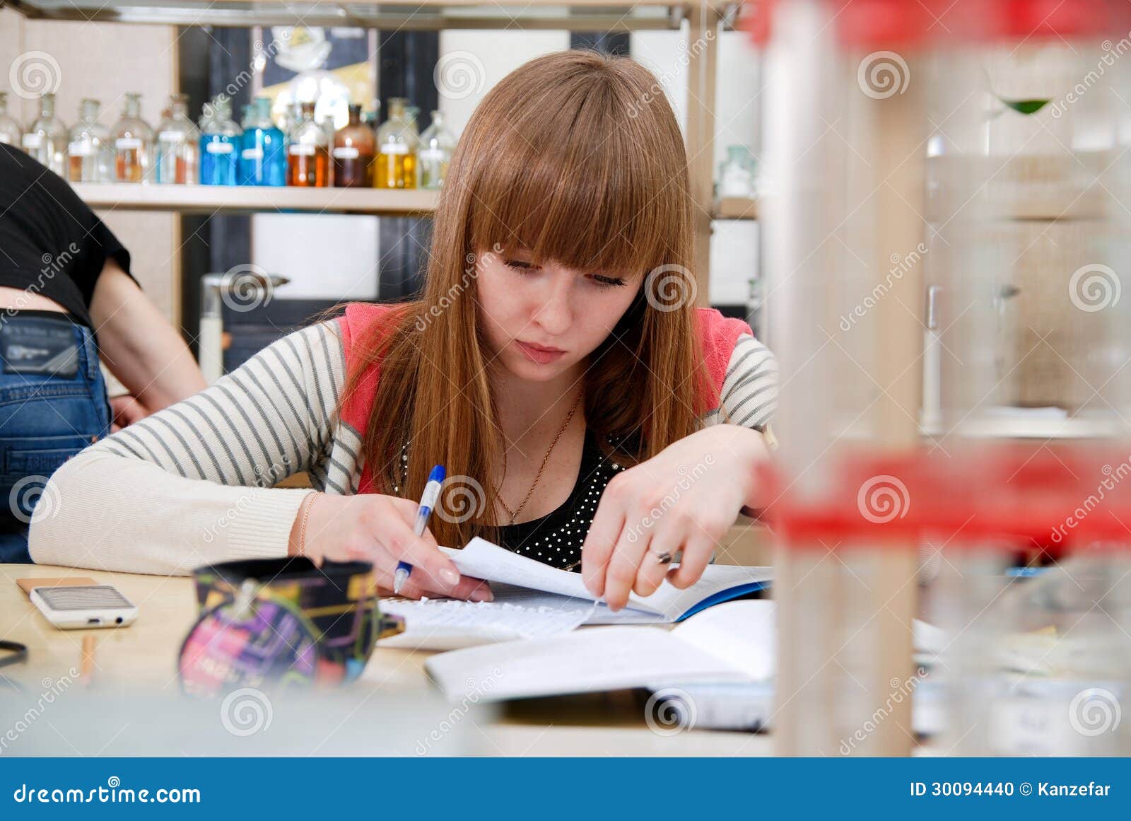 A Student at Work in Laboratory of Chemistry Studies the Records Stock ...