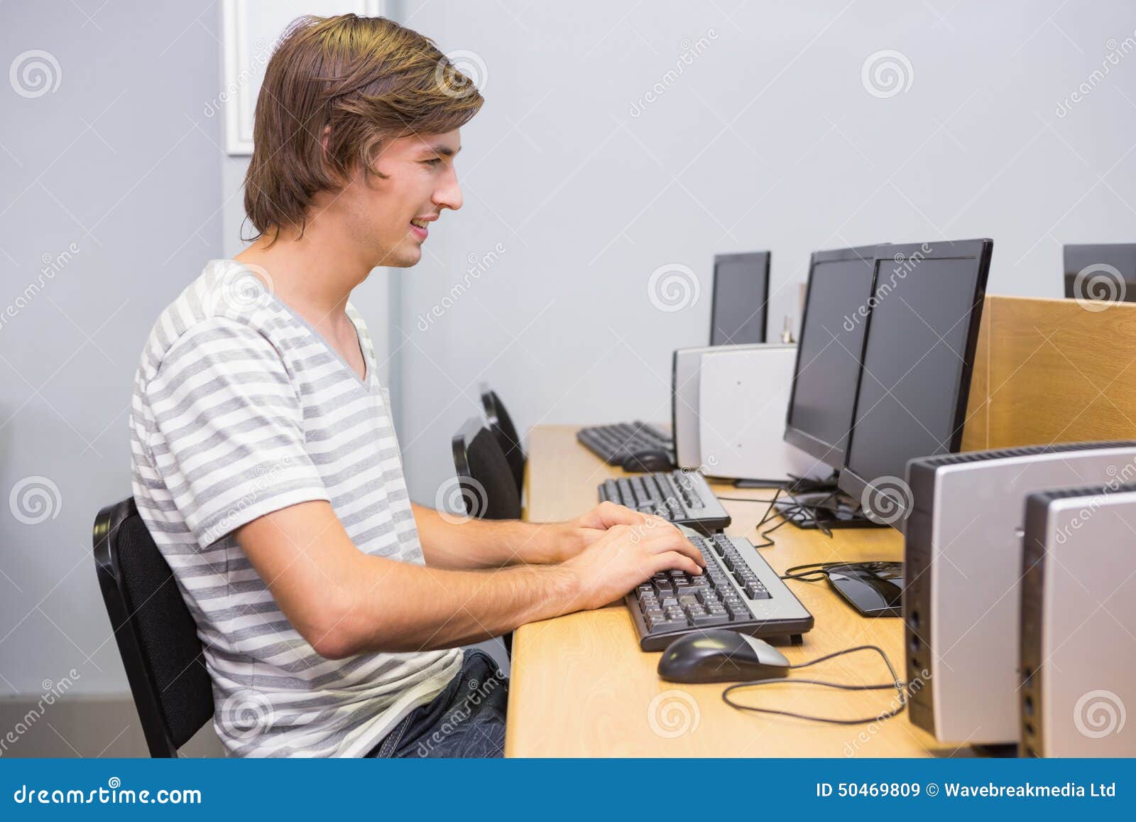 Student Working on Computer in Classroom Stock Image - Image of casual ...