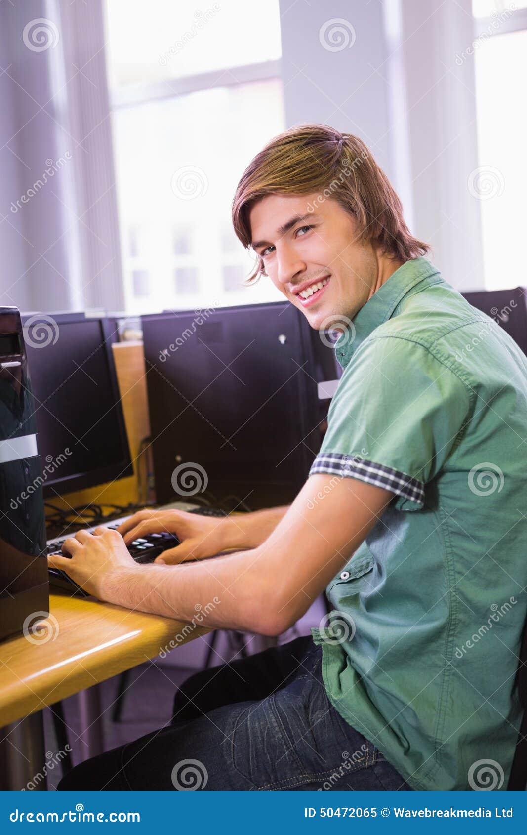 Student Working on Computer in Classroom Stock Image - Image of smiling ...