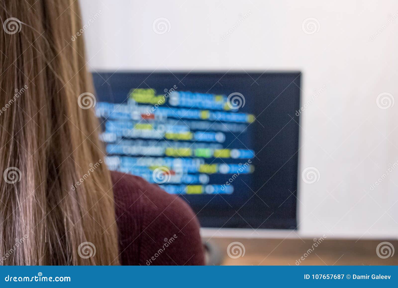 A Student Working at Home Using the Computer, Watching the Screen ...