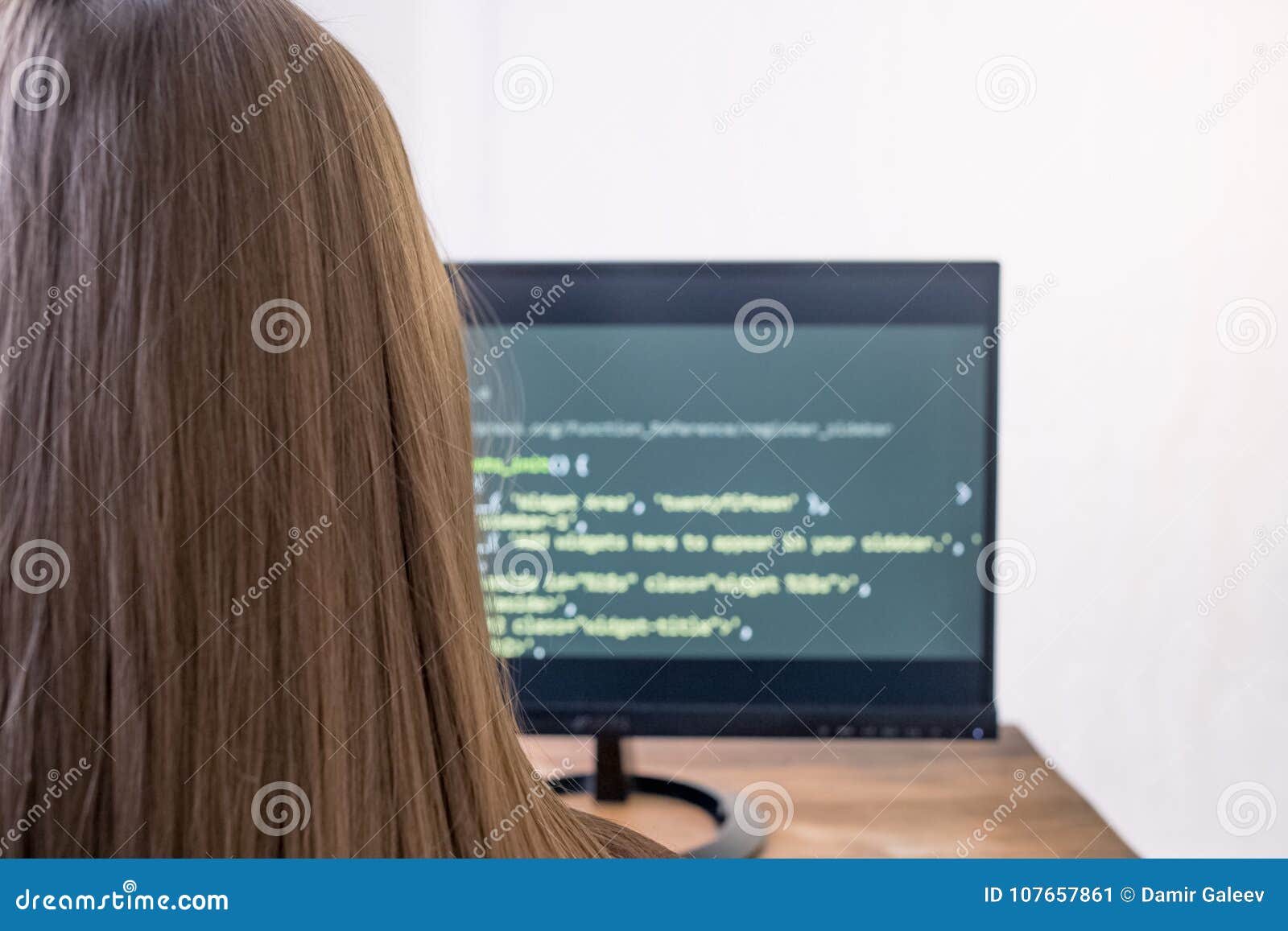 A Student Working at Home Using the Computer, Watching the Screen ...