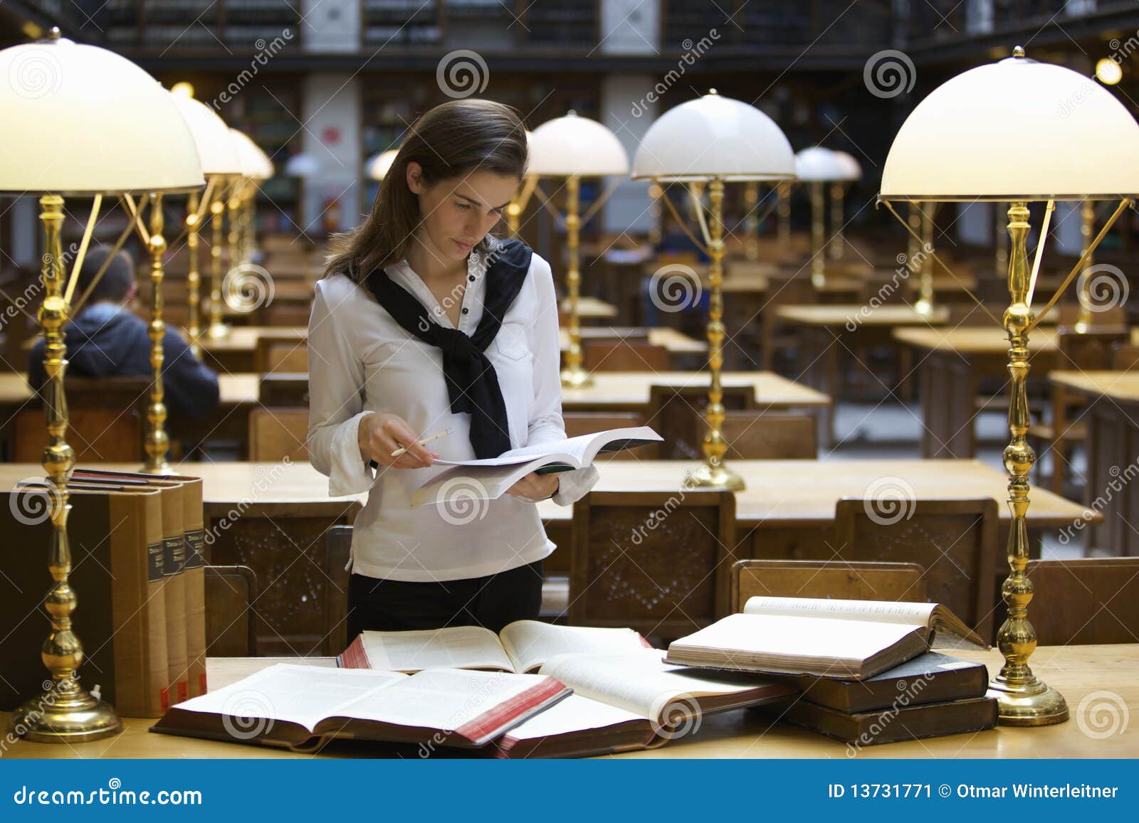 Student working in library stock image. Image of people - 13731771