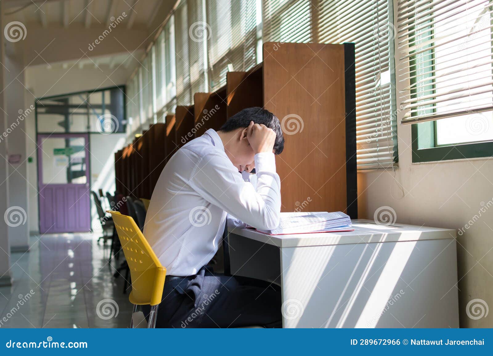 An Asian Student Filing Sad Stock Photo - Image of annoyed, library ...