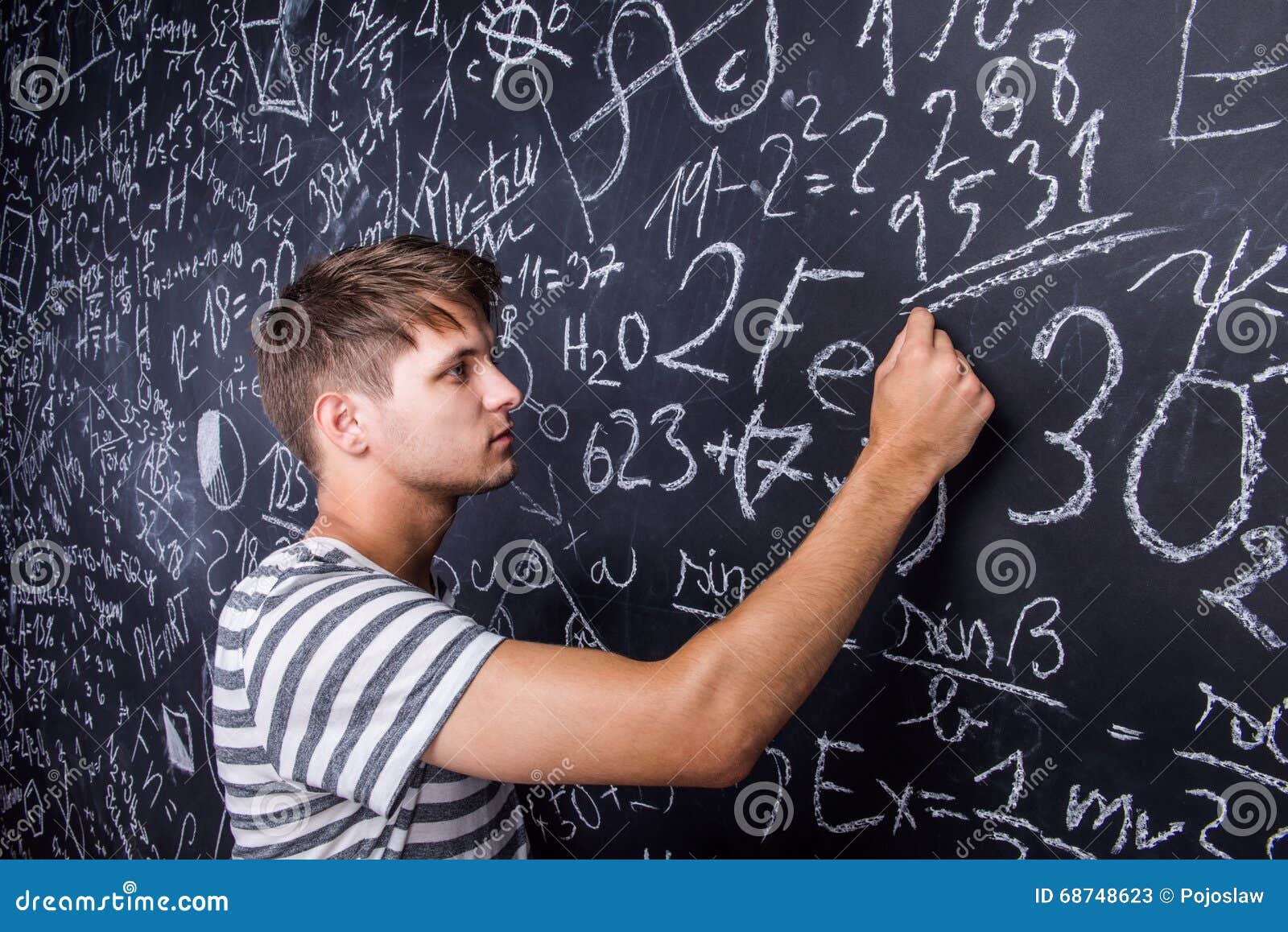 Student Writing on Big Blackboard with Mathematical Symbols Stock Image ...