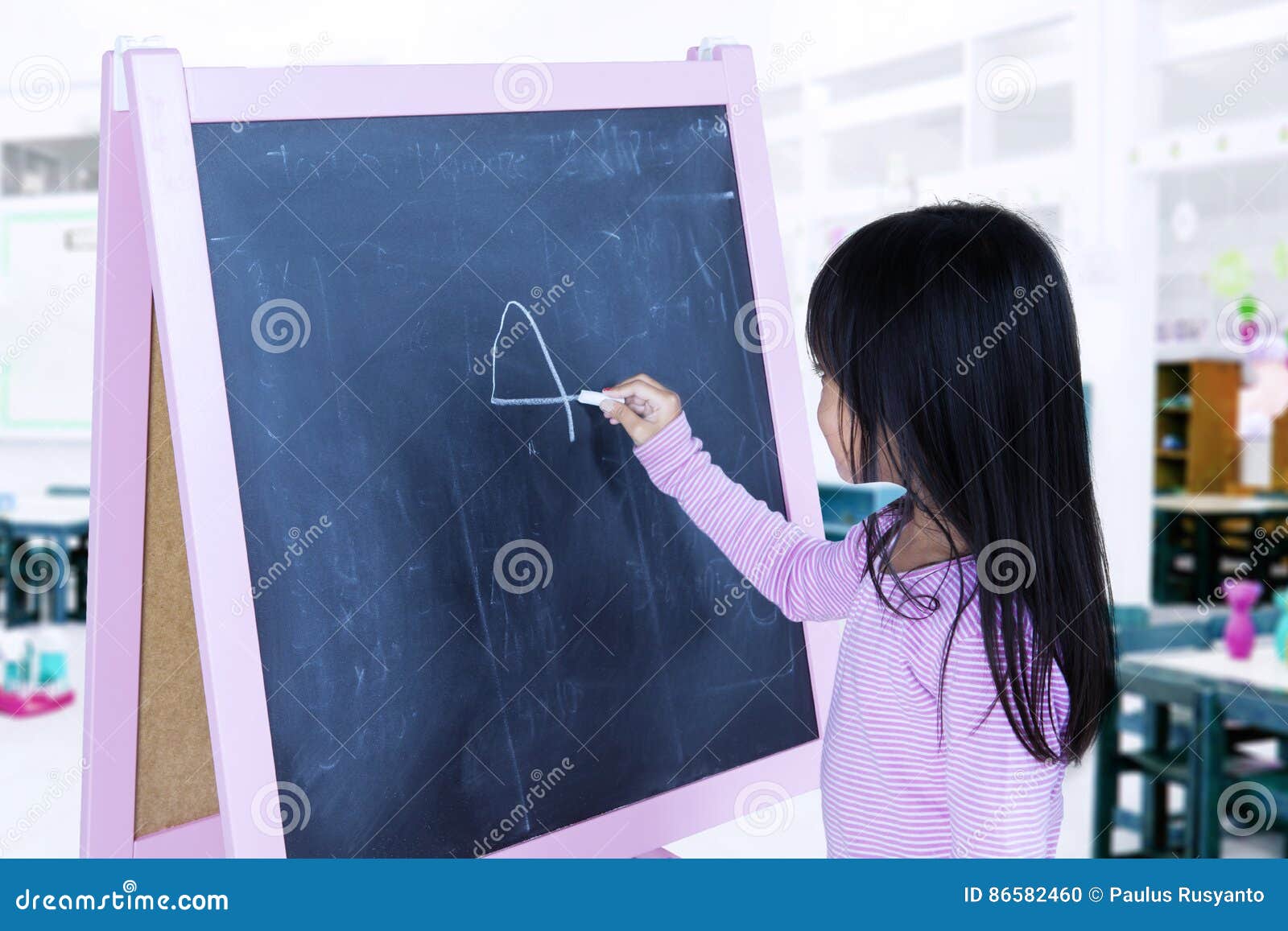 Student Writing on Blackboard in Classroom Stock Photo - Image of ...