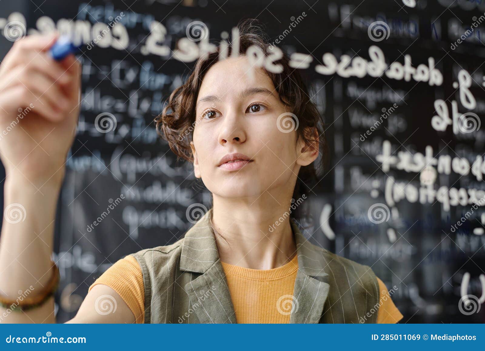 Student Writing on Blackboard in the Classroom Stock Image - Image of ...