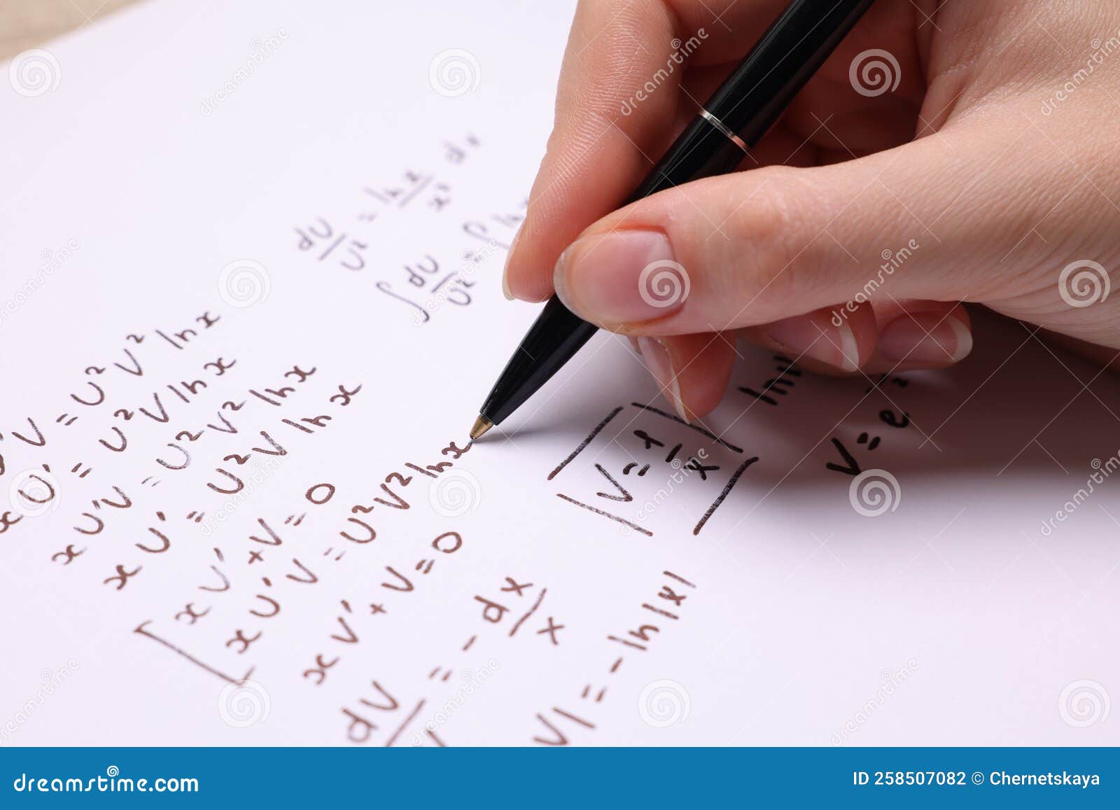 Student Writing Different Mathematical Formulas on Paper, Closeup Stock ...