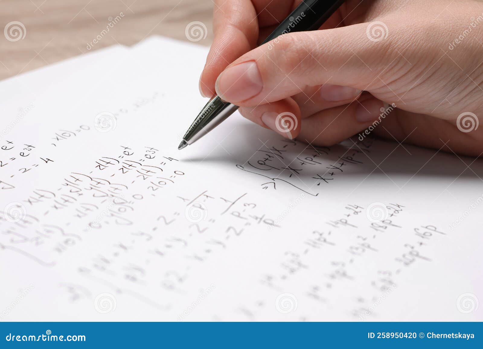 Student Writing Different Mathematical Formulas on Paper, Closeup Stock ...