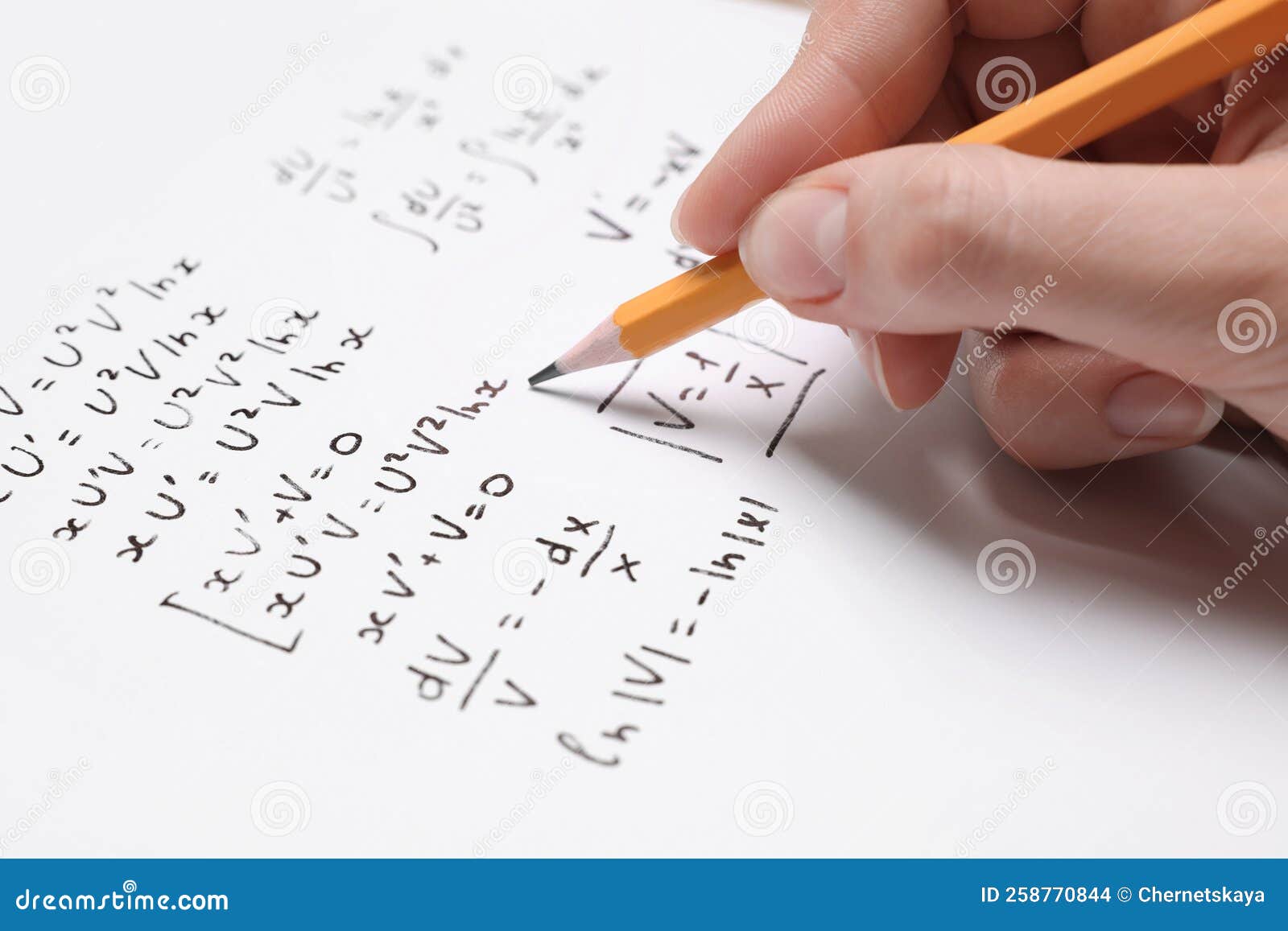Student Writing Different Mathematical Formulas on Paper, Closeup Stock ...