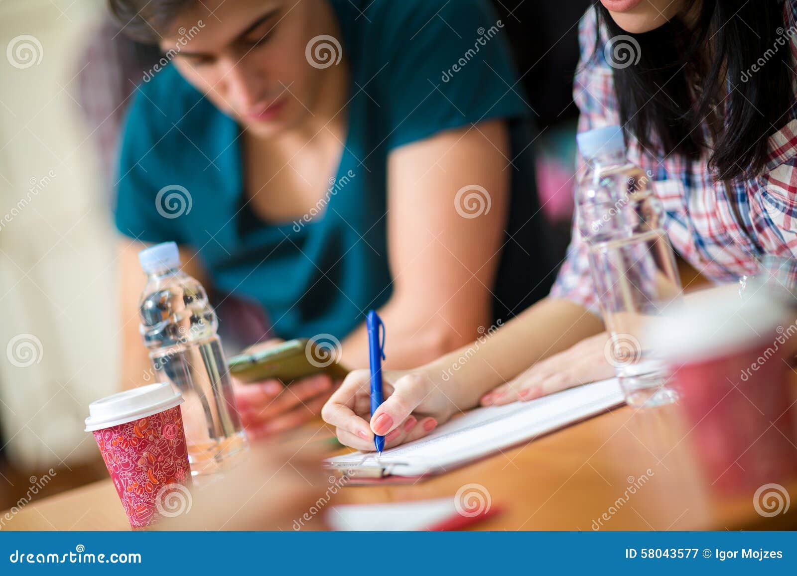 Student writing her task stock image. Image of indoor - 58043577
