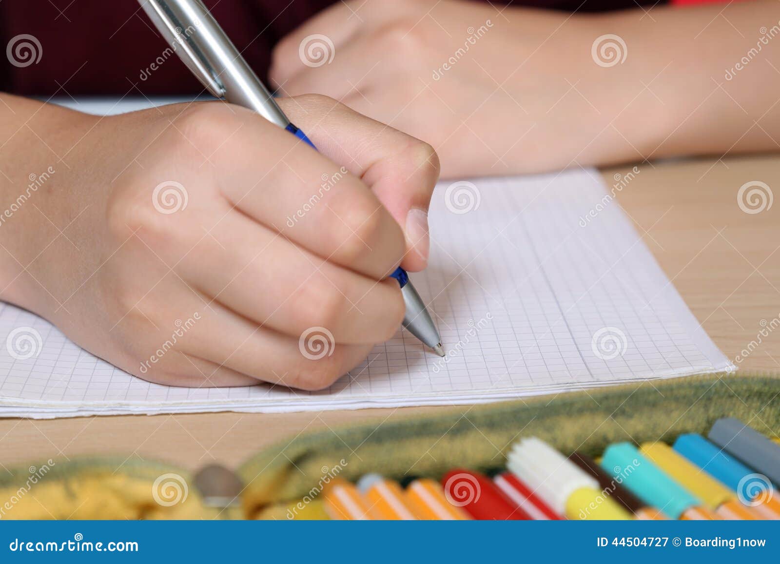 Student Writing in His Exercise Book at School Stock Image - Image of ...