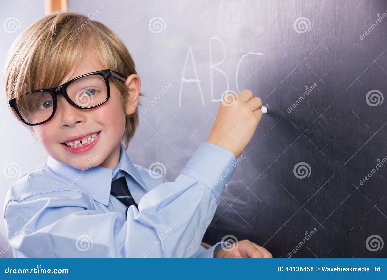 Student Writing on Large Blackboard Stock Photo - Image of child ...