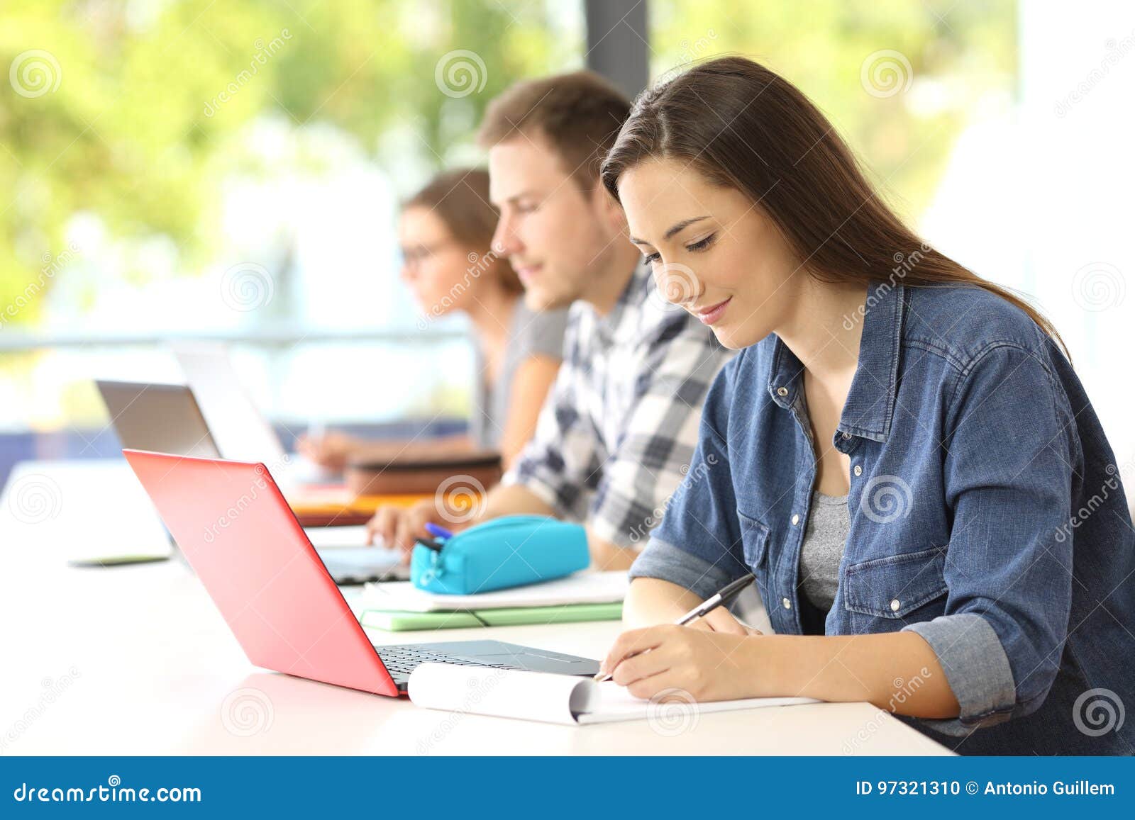 Student Writing Notes in a Classroom Stock Photo - Image of classroom ...